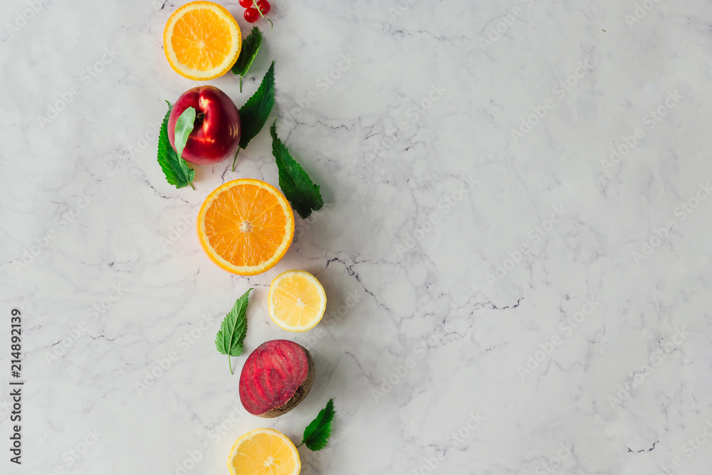 Creative food layout with fruits, vegetables and leaves on bright ...