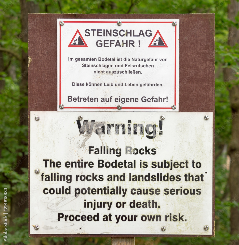 Warning sign of falling rocks and landslides at the entrance of the ...