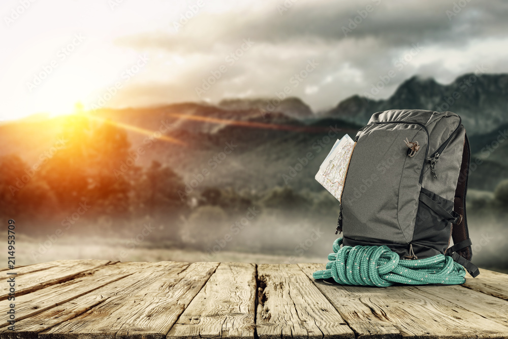 Backpack on wooden desk with free space for your decoration and ...