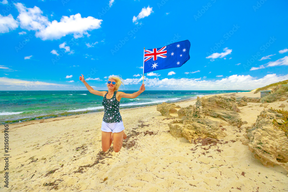 Fotografia do Stock: Happy woman jumping on white beach waving ...