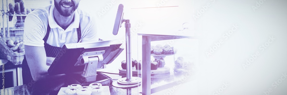 Smiling worker posing behind the counter Stock Photo | Adobe Stock
