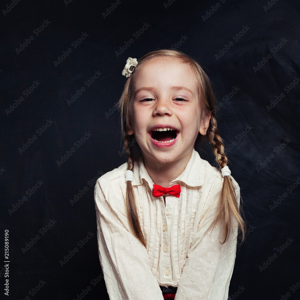 Cute girl having fun, yelling and laughing. Happy child on empty ...