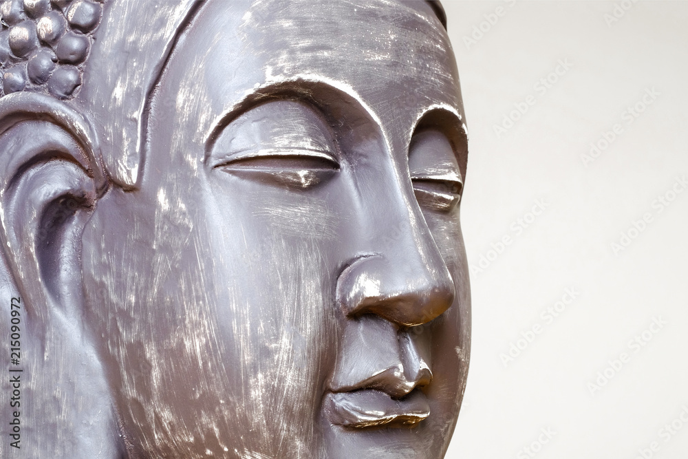 Buddha's face close-up. The Buddha image in ceramics. The texture of ...