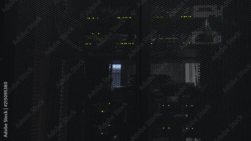 Working Ethernet switch in data center room. Ethernet Network Connection Hub. Blinking lights in ...