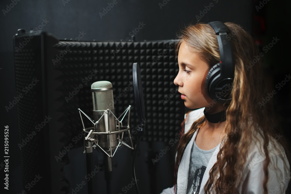 little girl singing in recording studio Stock Photo | Adobe Stock