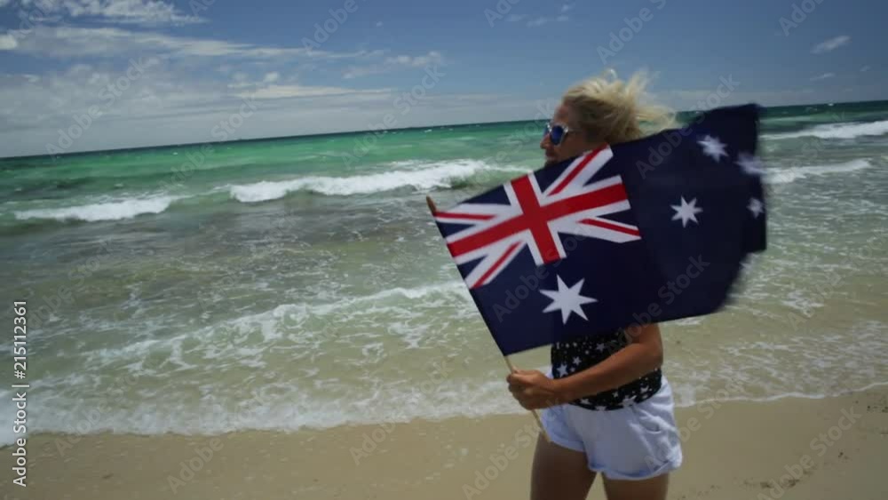 Freedom woman running on white beach waving Australian Flag. Blonde ...