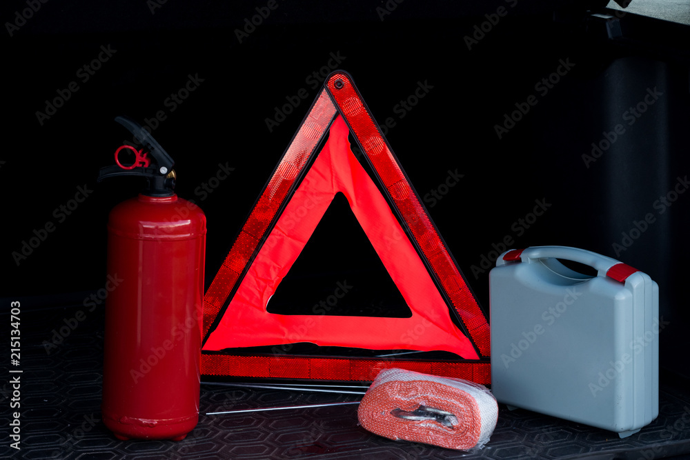 Set of fire extinguisher, first aid kit, emergency stop sign and tow ...