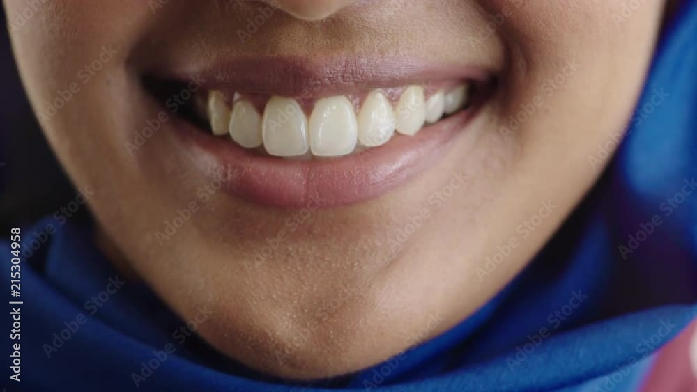 close up woman mouth smiling happy satisfaction middle eastern female ...