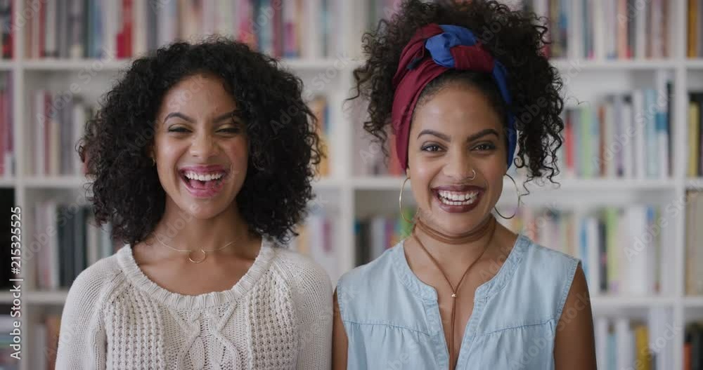 portrait beautiful young hispanic twin sisters laughing together lively ...