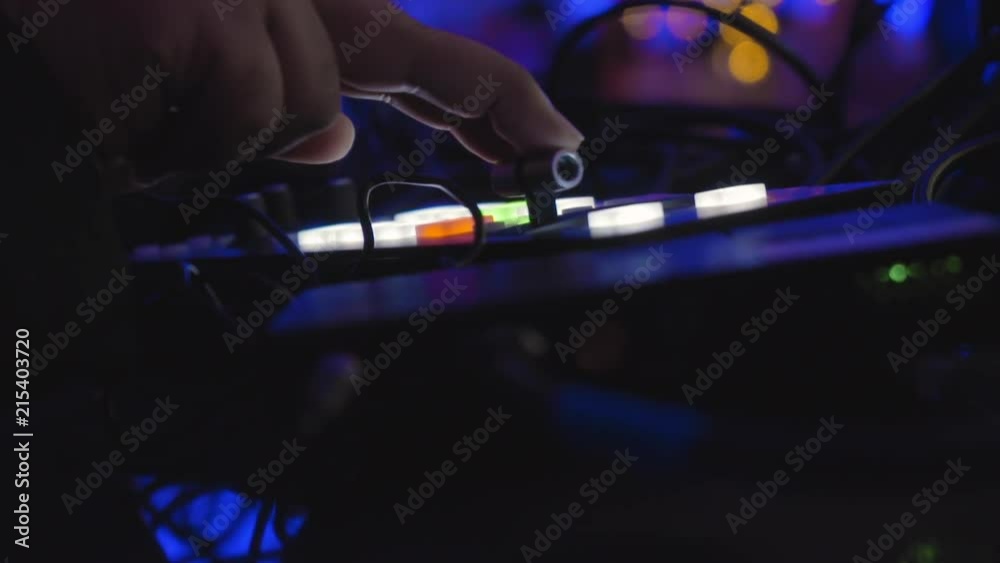 Close up of a video switcher/mixer being used during an event, It shows ...