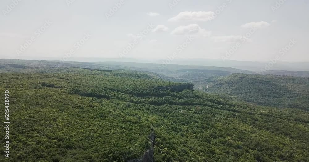 Footage of an old European Monastery and country side covered in green ...