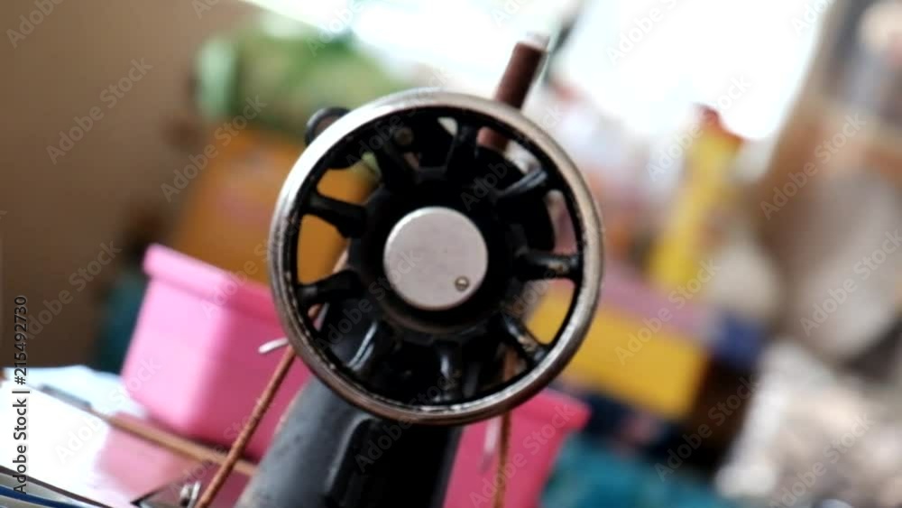 A vintage sewing machine's balance wheel. Stock Video | Adobe Stock