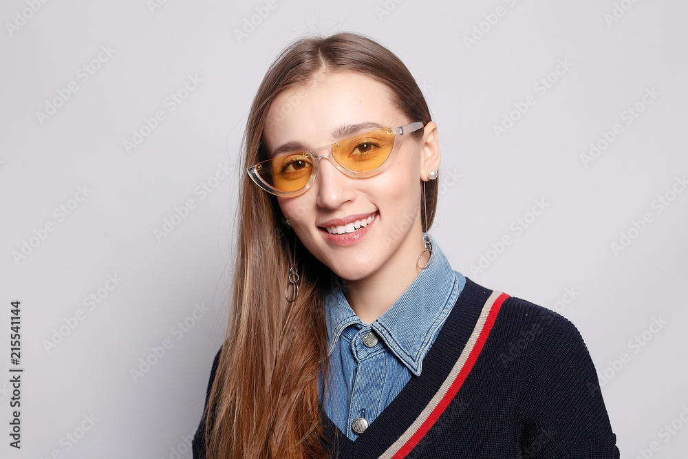 Pretty smiling joyfully female with fair hair, dressed casually ...