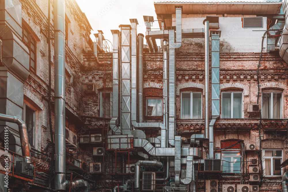 Facade of an old factory building in an industrial zone: brick wall ...