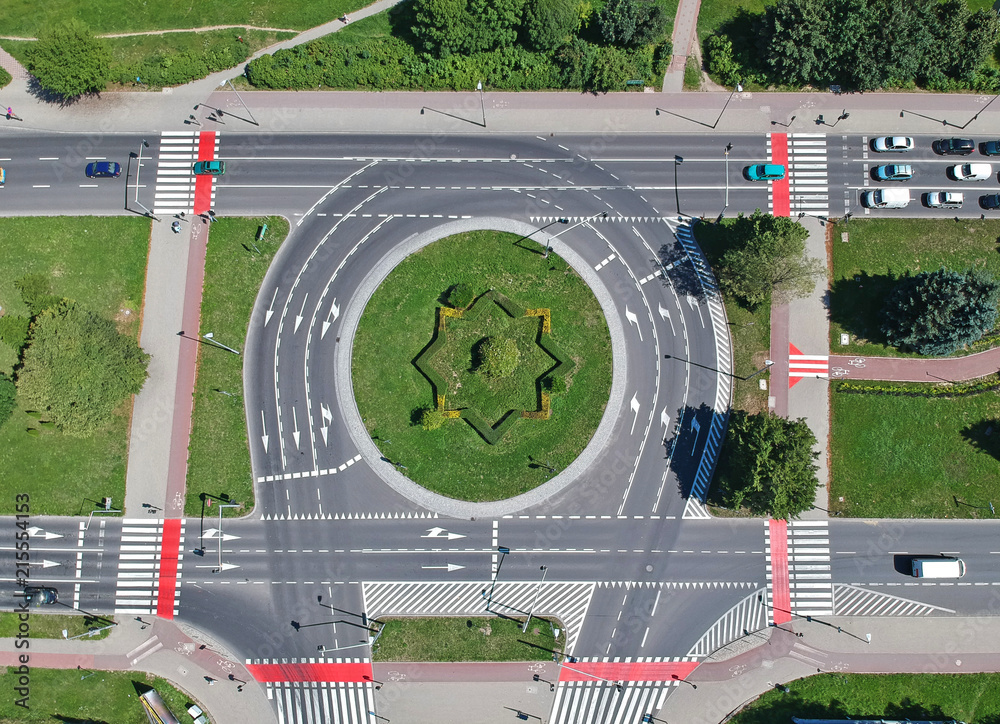 Roundabout intersection in four directions with island, aerial view ...