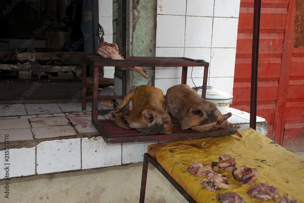 heads of cows in the meat market in conditions of unsanitary. Dirt and ...