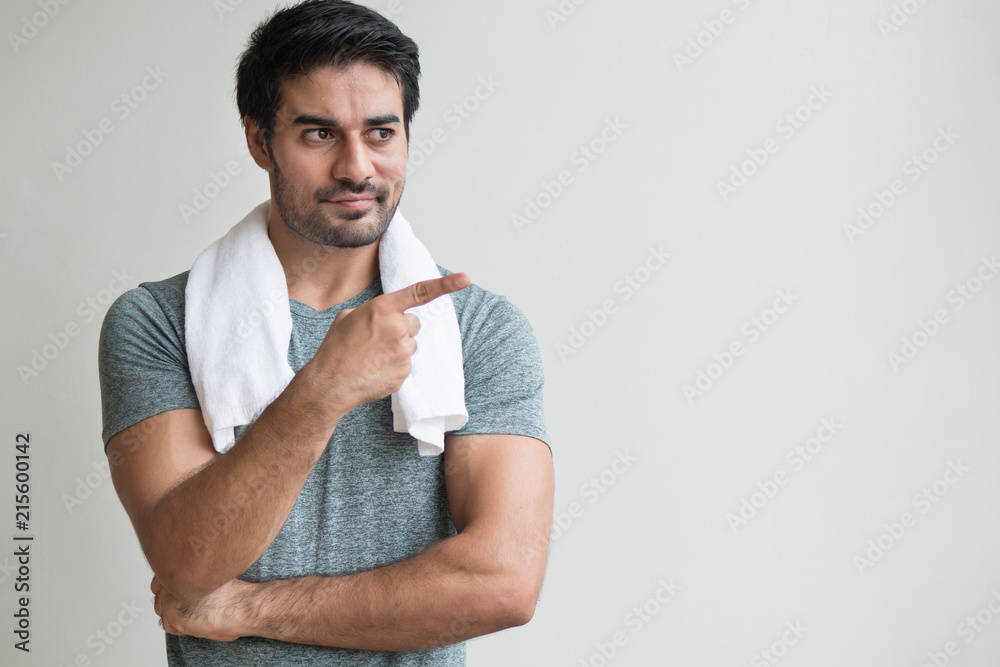 confident fitness man pointing finger; portrait of happy, healthy ...