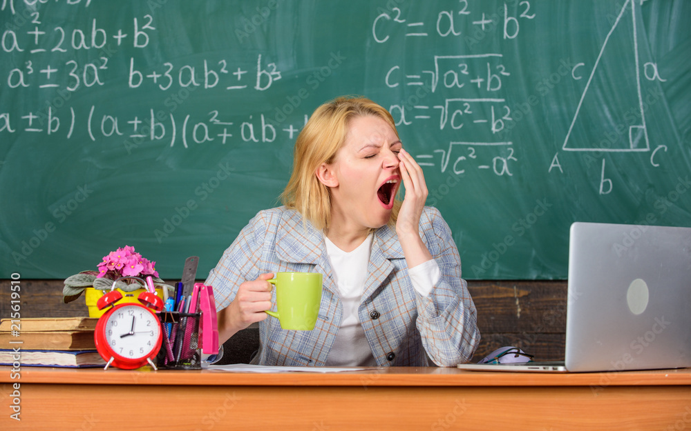 Workaholic sleepy at workplace. Teacher woman sit table classroom ...