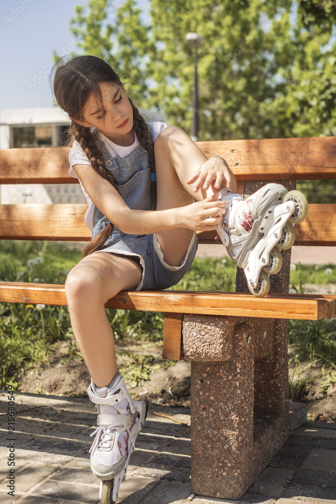 Cute little 10 years old girl in casual outfit playing at park in warm ...