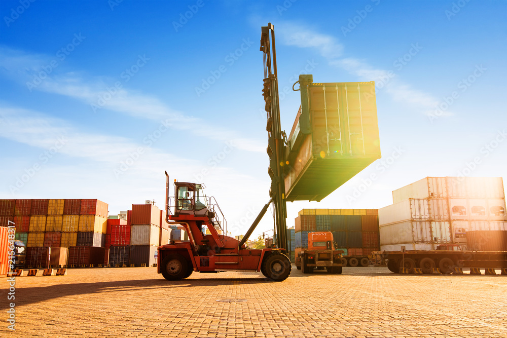 Crane lifting up container in yard Stock Photo | Adobe Stock
