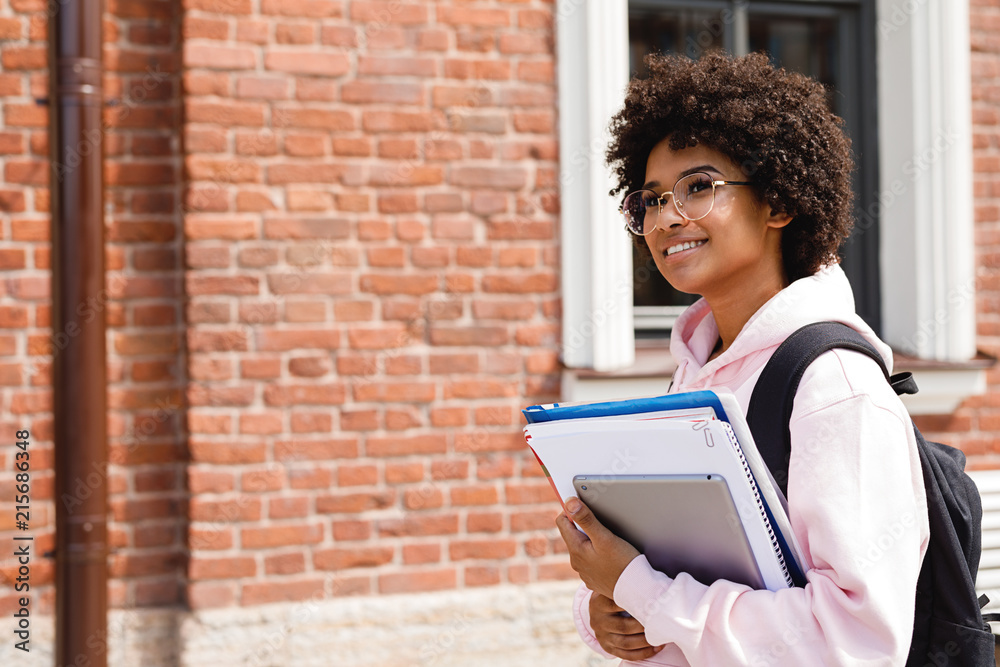 Beautiful student girl with books go to university Stock Photo | Adobe ...