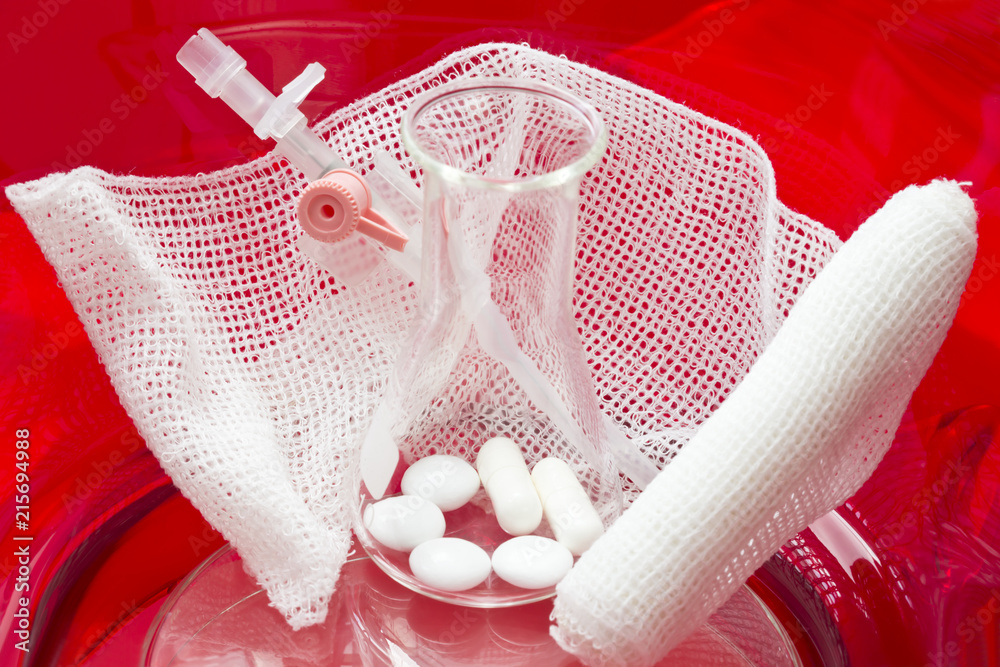 Vein access concept. Intravenous cannula, gaze and Erlenmeyer flask ...