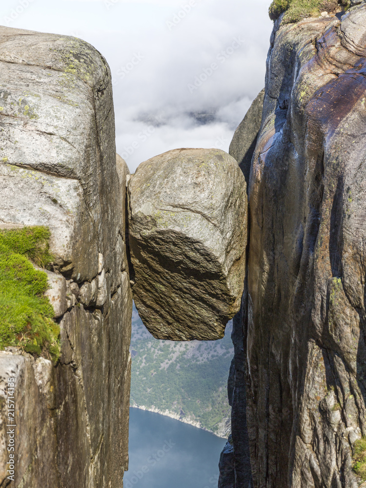 Kjeragbolten boulder located on the Kjerag mountain Stock Photo | Adobe ...