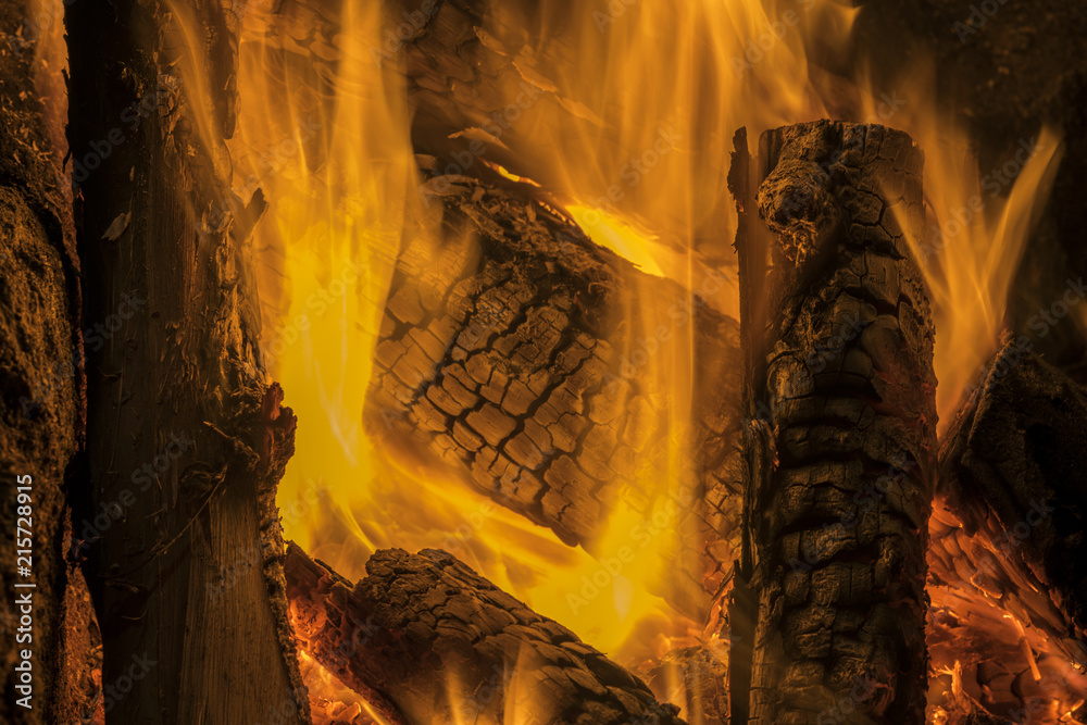 Fire moves across the wood without stop increasing it flames with the ...
