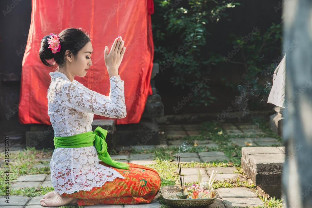 balinese woman praying at temple on small shrines in houses Stock Photo ...