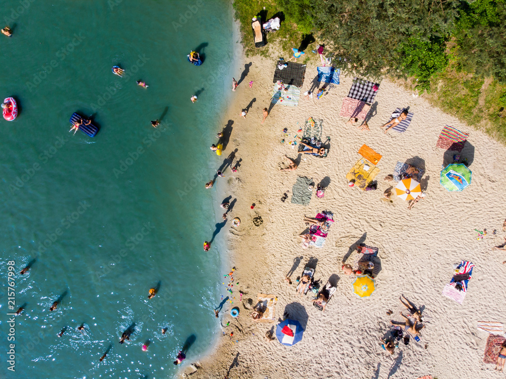 LVIV, UKRAINE - 9 JUNE, 2018: people sunbathing, swimming, resting at ...