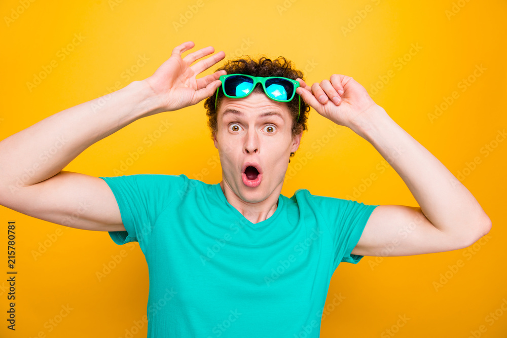 Young attractive handsome shocked guy wearing casual green polo t-shirt ...