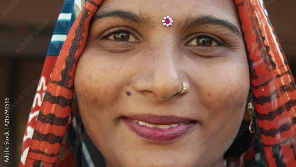 Extreme close up of a gorgeous Indian woman's face smiling laughing ...
