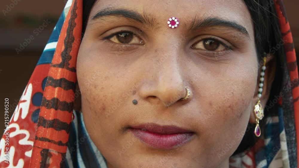Extreme close up of a gorgeous Indian woman's face smiling laughing ...