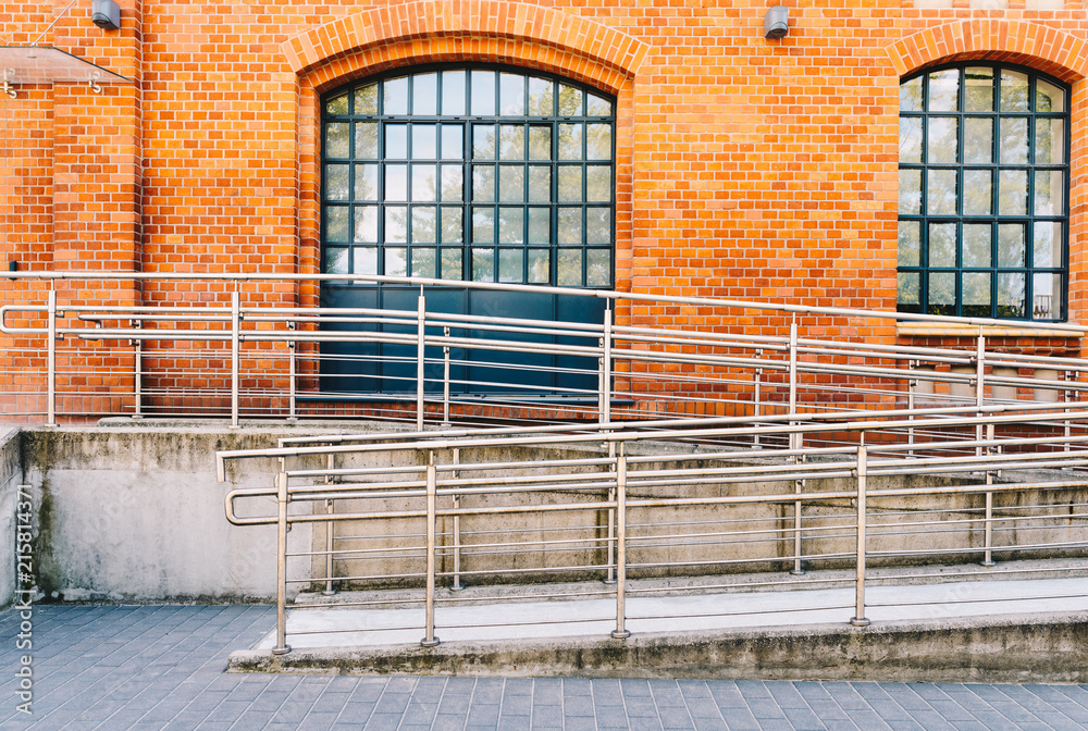 Concrete ramp way with stainless steel handrail Stock Photo | Adobe Stock