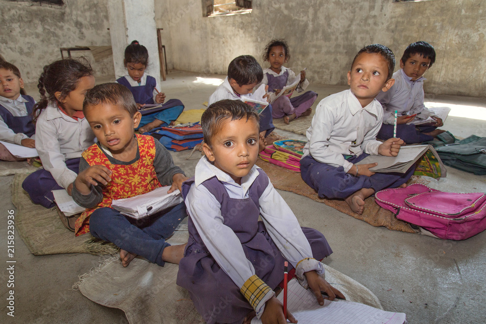 Indian Rural school kids learning from books in the classroom. Stock ...