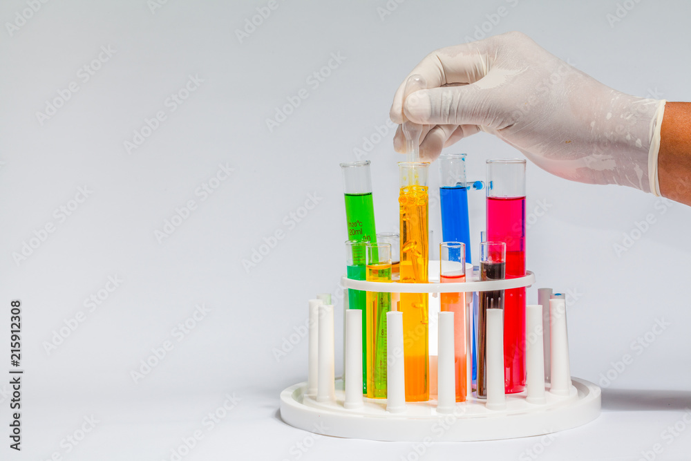 Experiments in mixing chemical substances into glass tubes with a ...