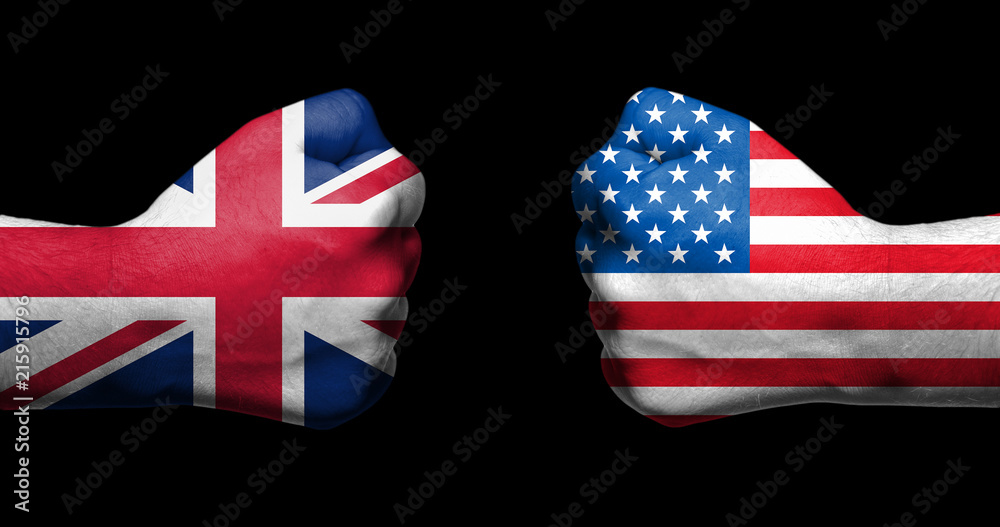 Flags of United Kingdom and Unied States painted on two clenched fists ...