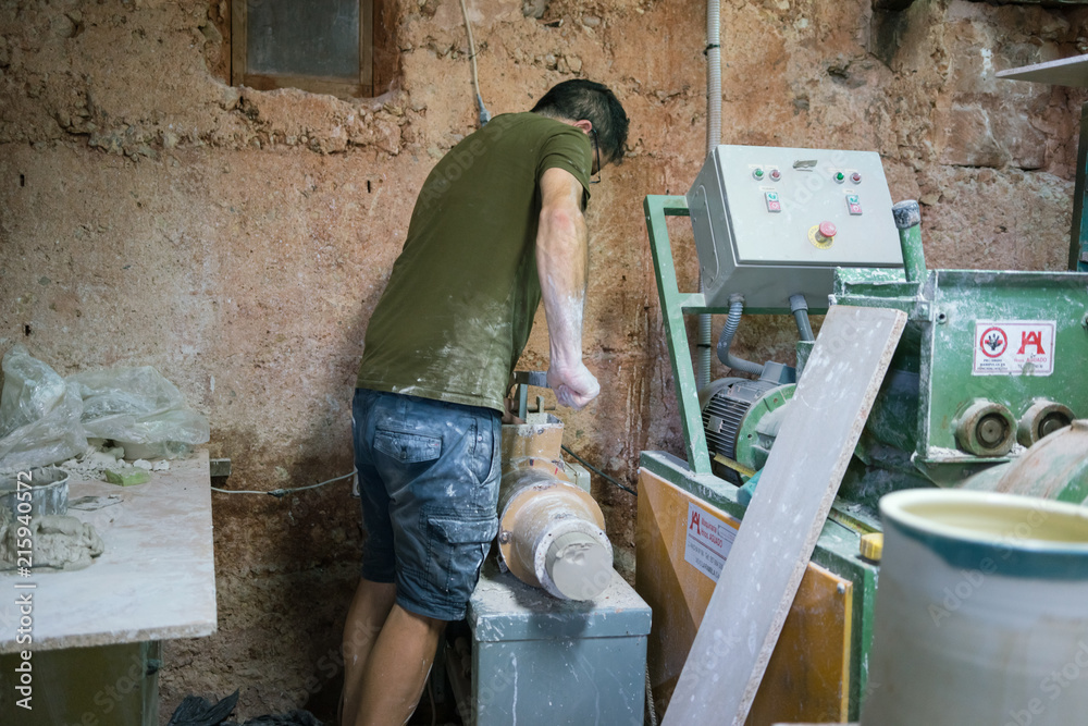 Ceramic dishes in working process. Creating ceramic pieces. Tradicional ...