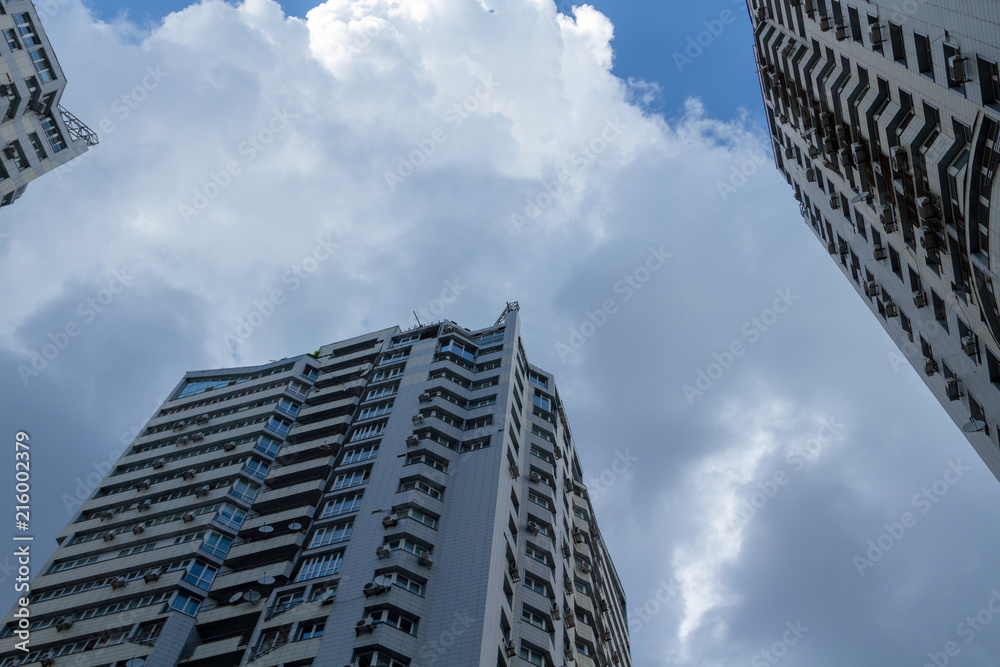 View from the courtyard between three high-rise buildings. High-rise ...