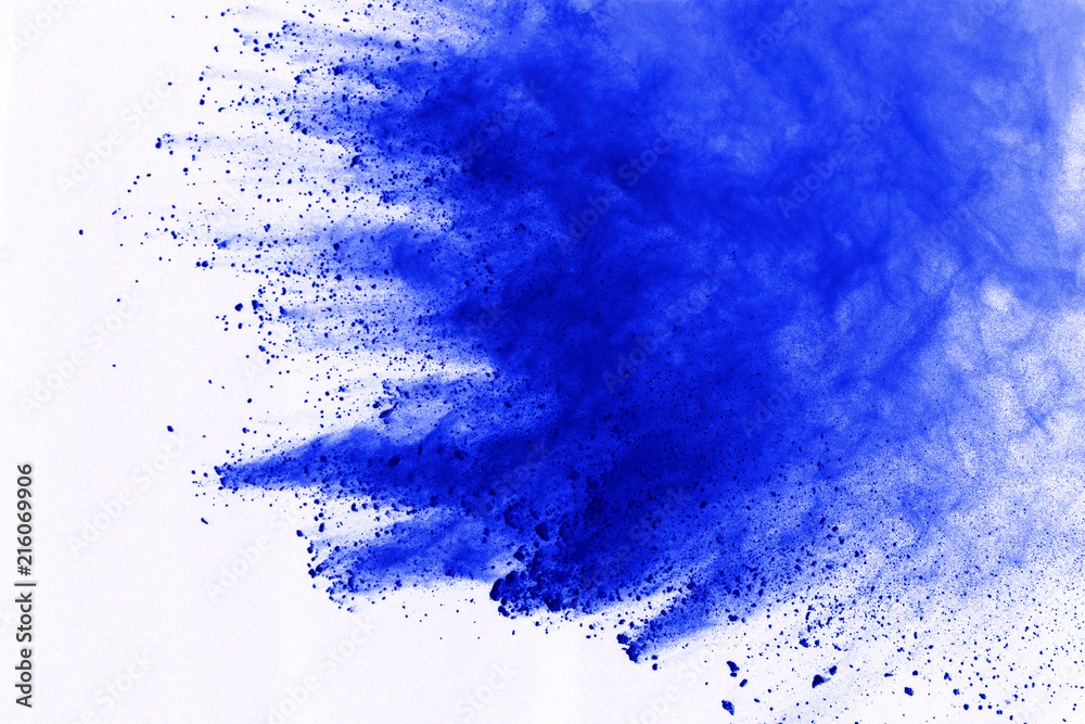 Abstract of blue powder explosion on white background. Blue powder ...
