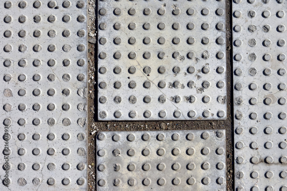 Cobbles of concrete blocks with a protruding texture. Relief against ...