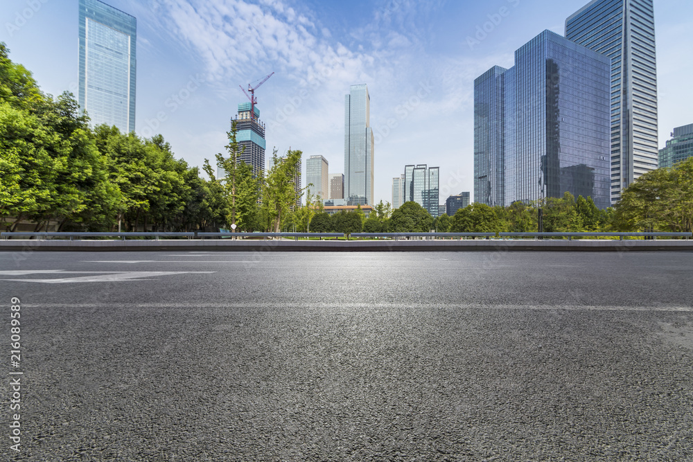 Panoramic skyline and modern business office buildings with empty road ...