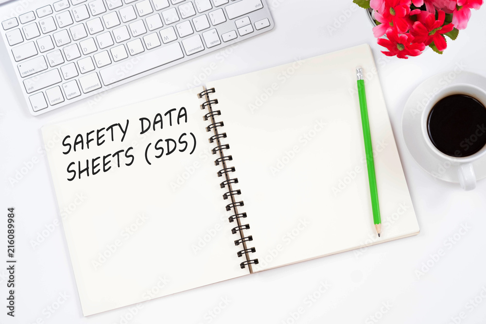 Concept SAFETY DATA SHEETS (SDS) message with modern workplace on white ...