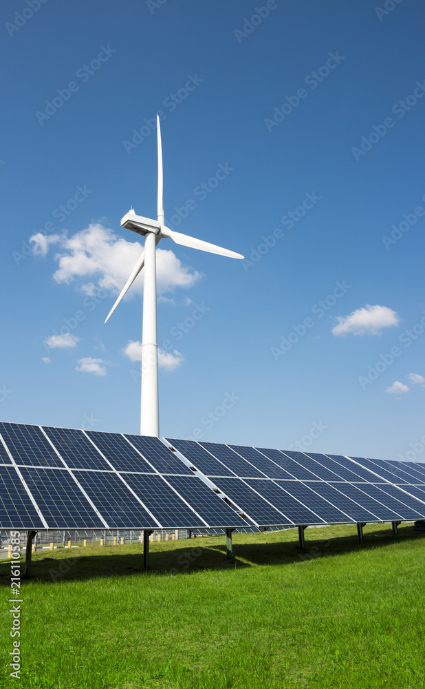 wind generator of electricity from three blades and solar panels of a ...