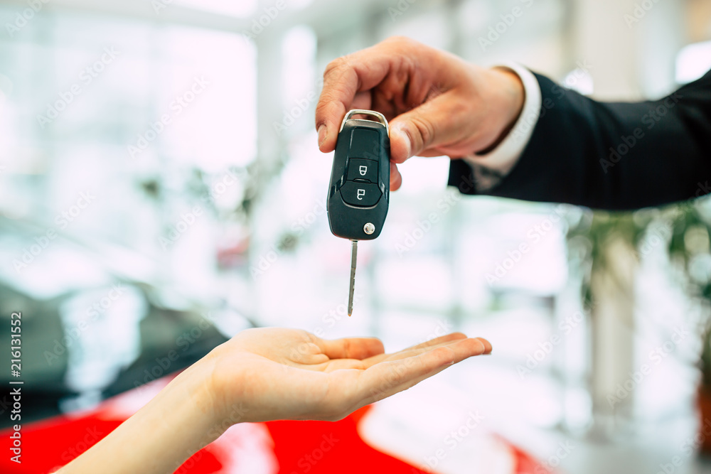 Hand over a car keys in dealership. Perfect choice. Stock Photo | Adobe ...
