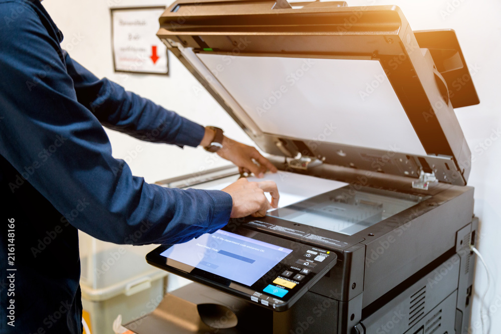 Bussiness man Hand press button on panel of printer, printer scanner ...