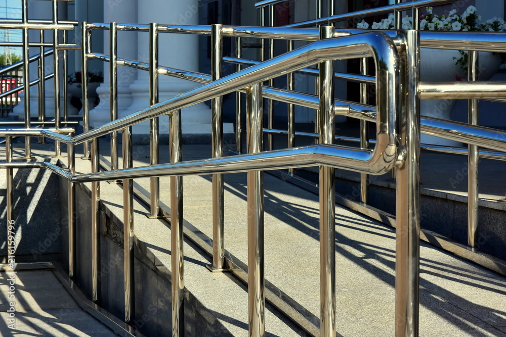 ramp with stainless steel fencing and chrome-plated metal structures ...