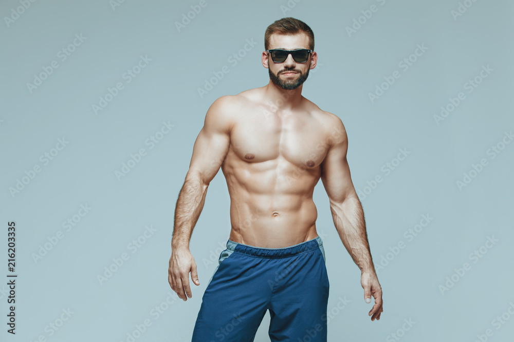 .bodybuilder posing. Beautiful sporty guy male power. Fitness muscled ...