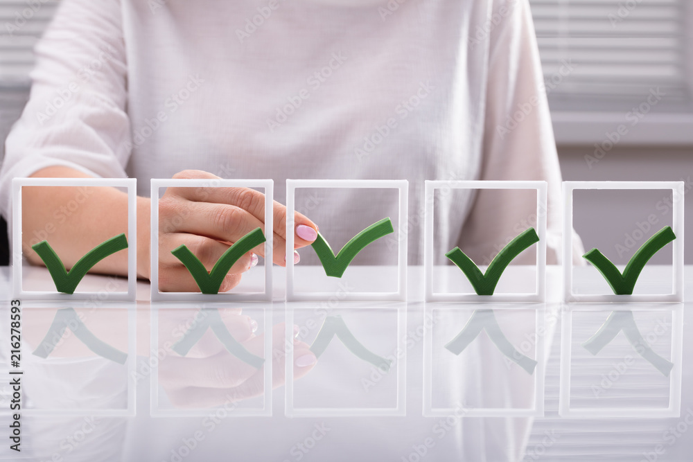 Businesswoman Placing Check Mark Inside Check Box Stock Photo | Adobe Stock
