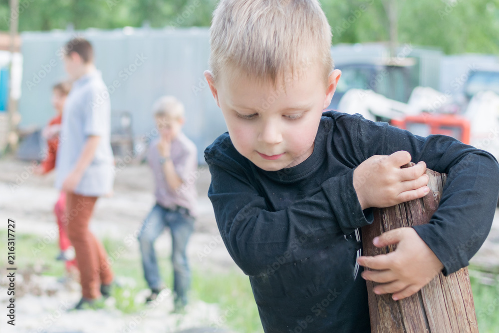 A little boy is playing alone on the playground. The problem of ...